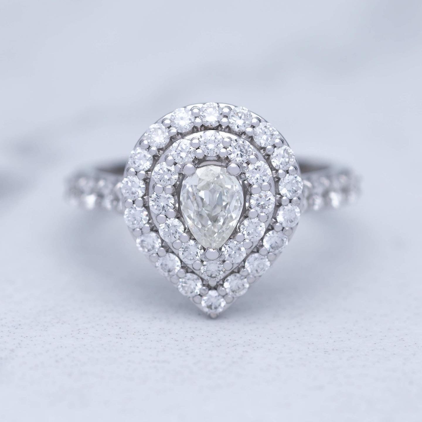 Halo Pear Shape Engagement Ring – The Diamond Studio